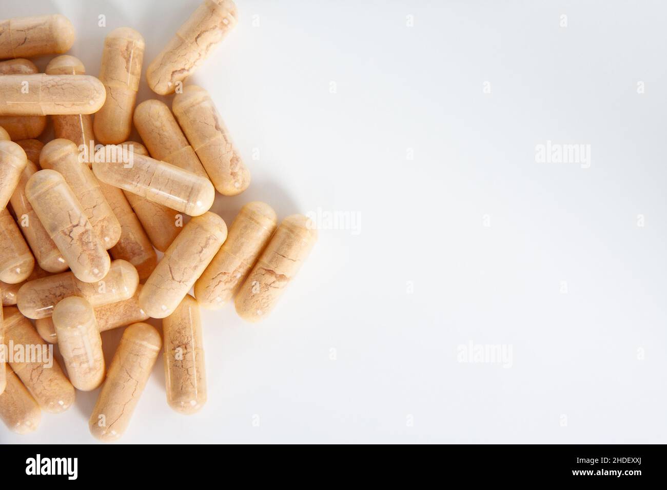 Top view detail of orange multivitamin supplements isolated on white ...