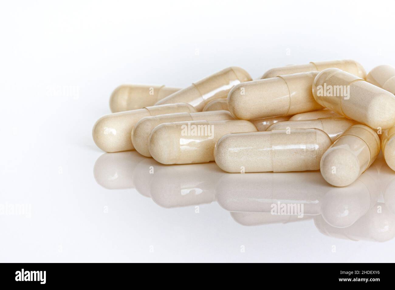 Front view of white vitamin supplements detail isolated on white ...