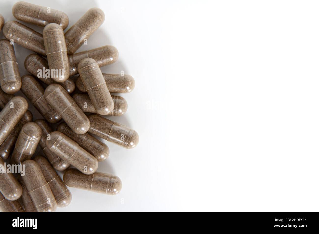 Vitex supplement capsules detail from above isolated on a white ...