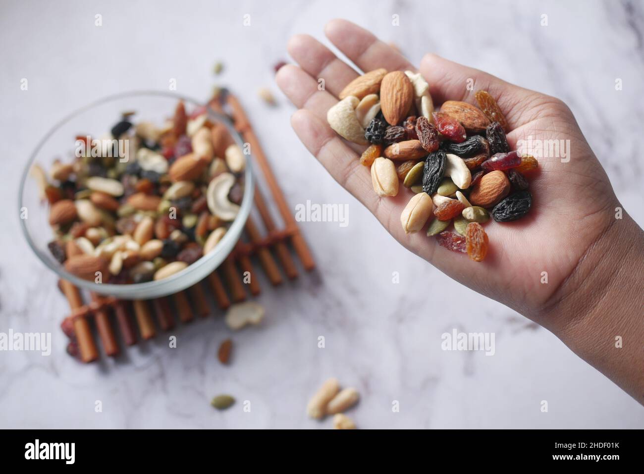 top v view of mixed nut on hand Stock Photo - Alamy