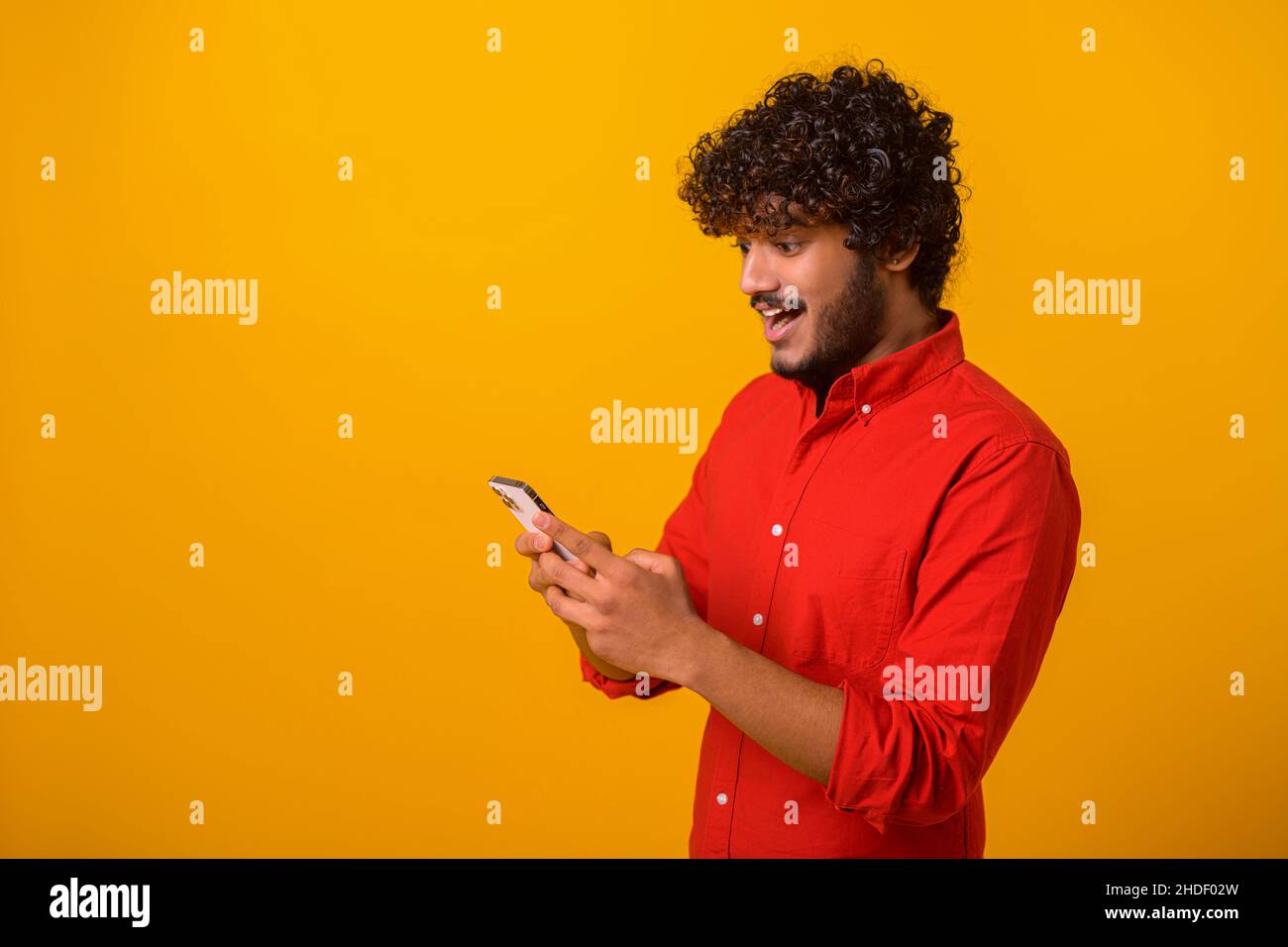 Young indian man scrolling hi-res stock photography and images - Alamy
