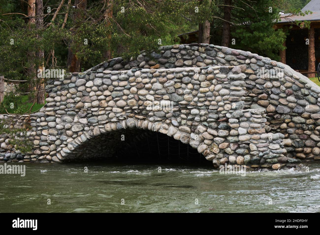 Old stone single arch bridge, Latvia. Famous ancient stone arch single ...