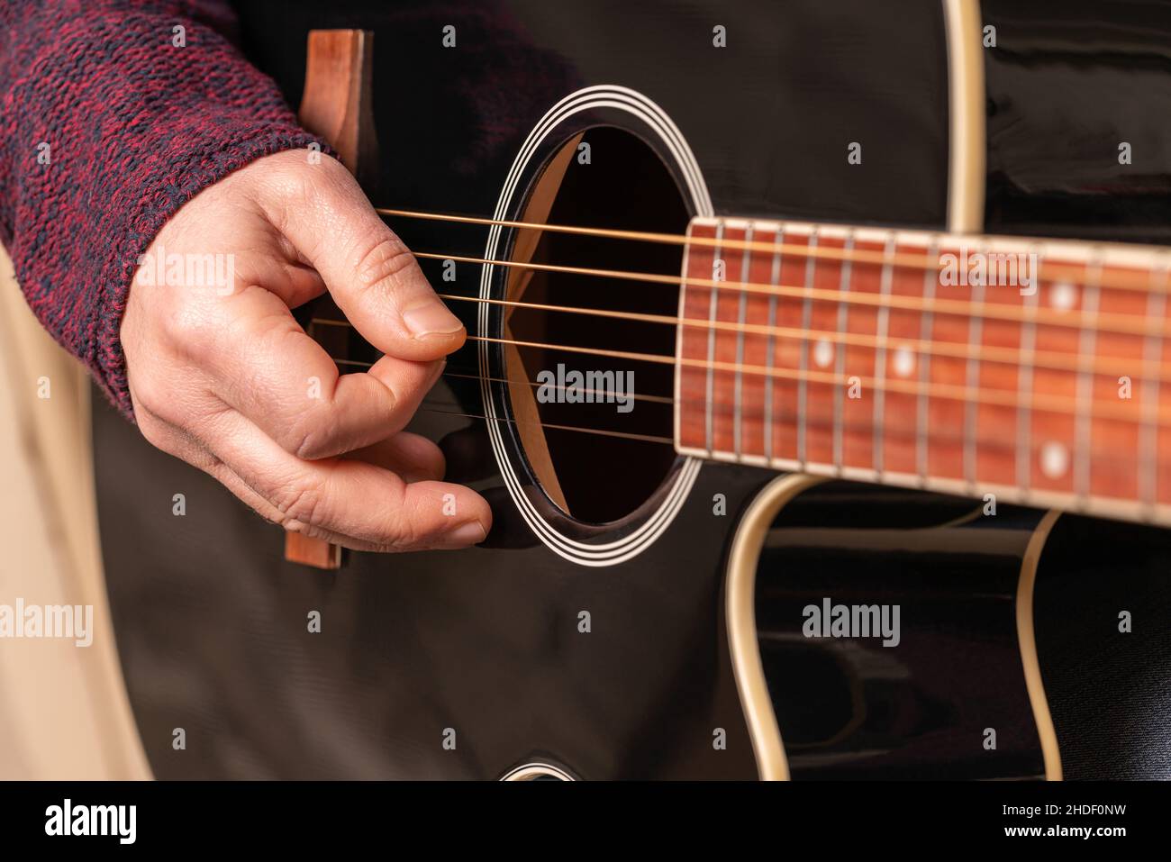Male hands play on strings hi-res stock photography and images - Alamy