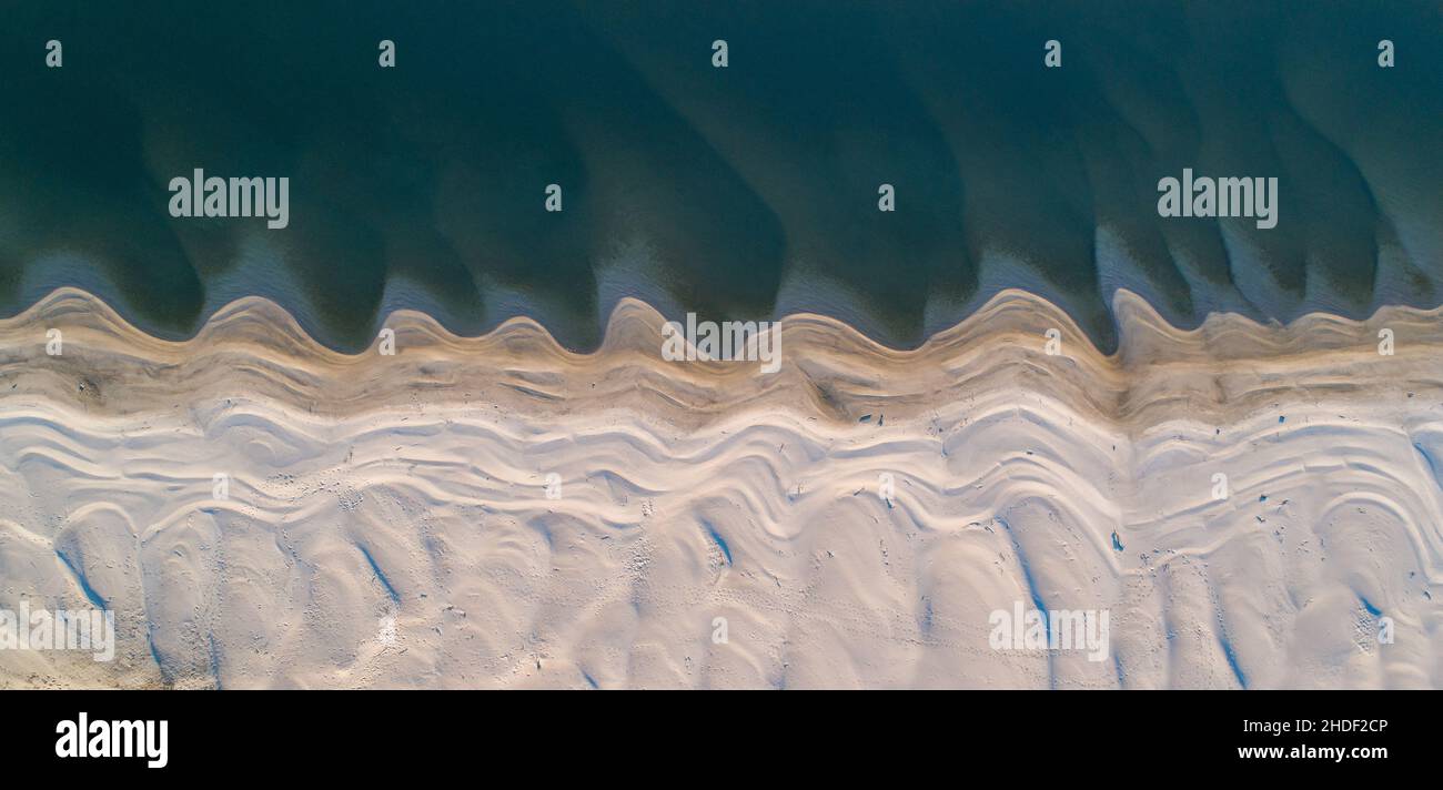 Aerial image of sandy dunes on river coast during low water level ...