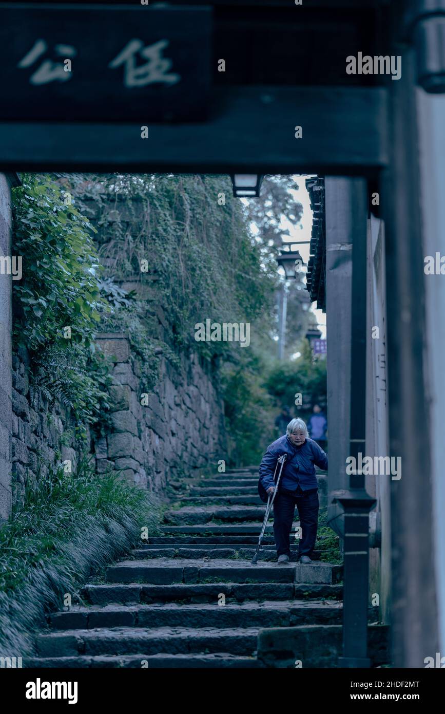 Senior walking down stairs hi-res stock photography and images - Alamy