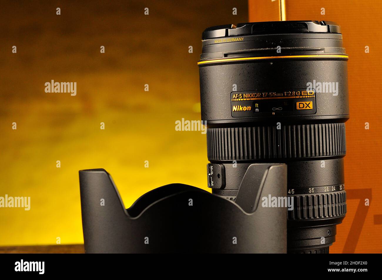 Zoom Nikon 17-55mm on studio shot, yellow background Stock Photo - Alamy