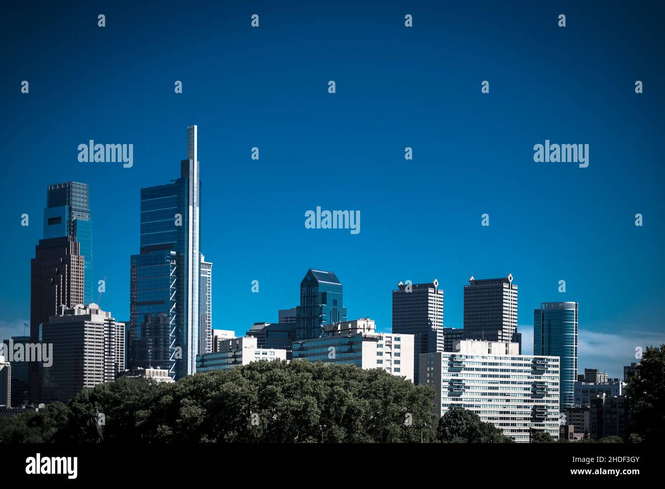 Cityscape of high-rise buildings under a clear blue sky in Philadelphia ...