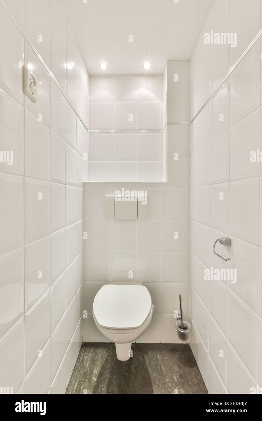 Interior of small clean restroom in miniature style Stock Photo - Alamy