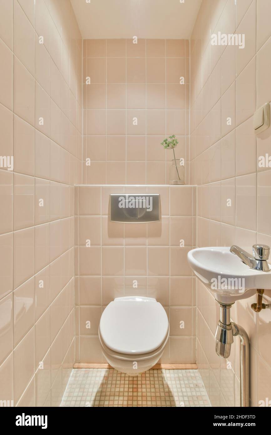 Interior of small clean restroom in miniature style Stock Photo - Alamy