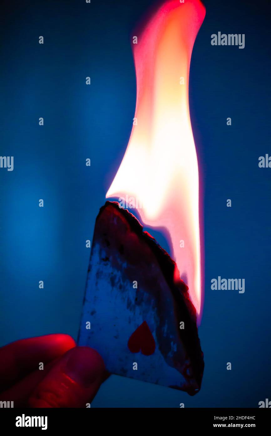 Vertical shot of a burning playing card Stock Photo - Alamy