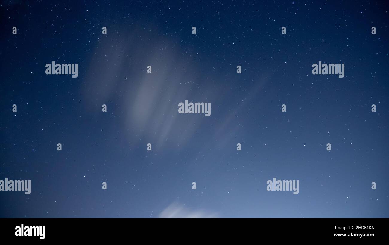 Beautiful view of motion light in blue night sky and stars on dark ...