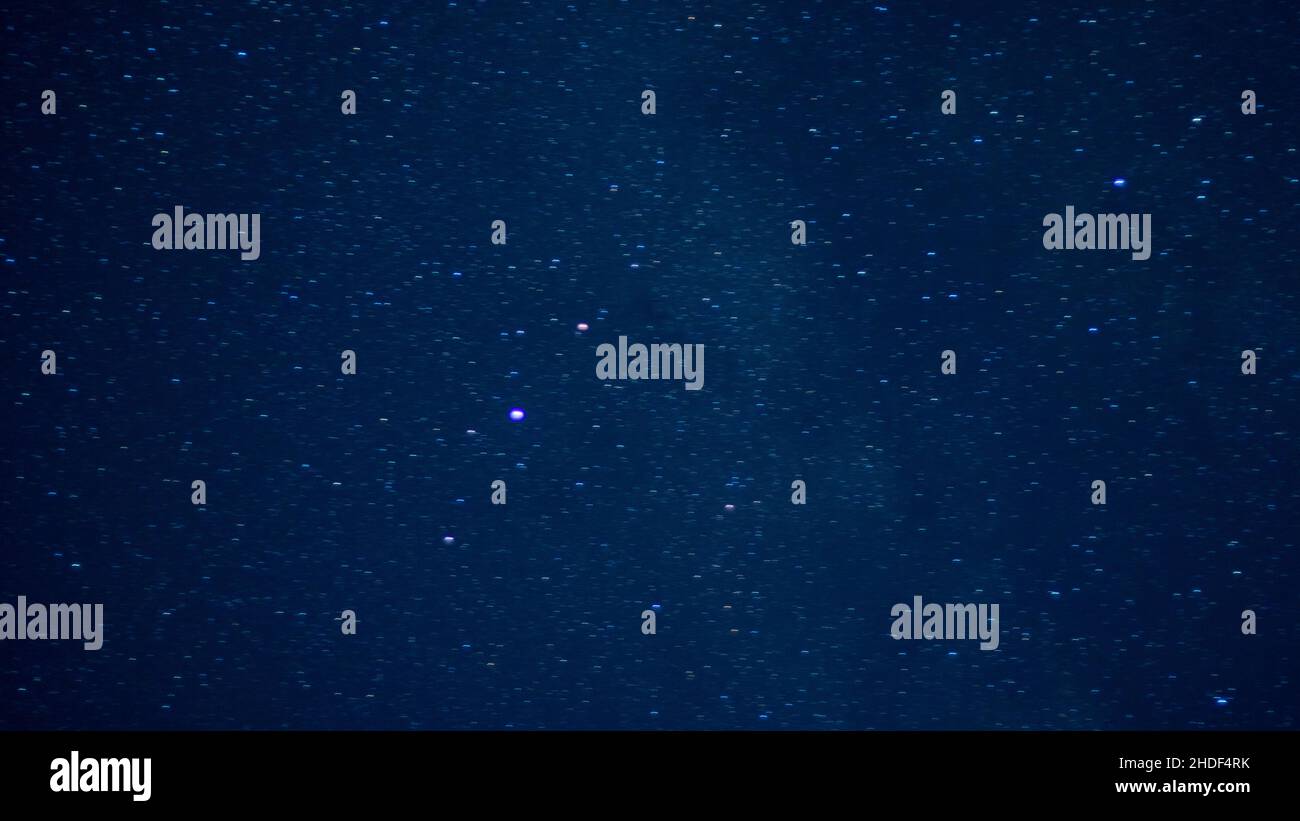 Beautiful view of a blue night sky and stars on dark background ...