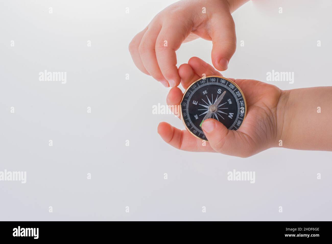 Hands holding compass body hi-res stock photography and images - Alamy