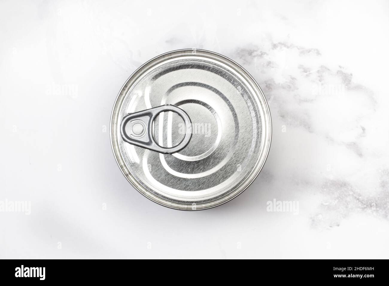 Closed can of preserves on a marble background in a top view Stock ...