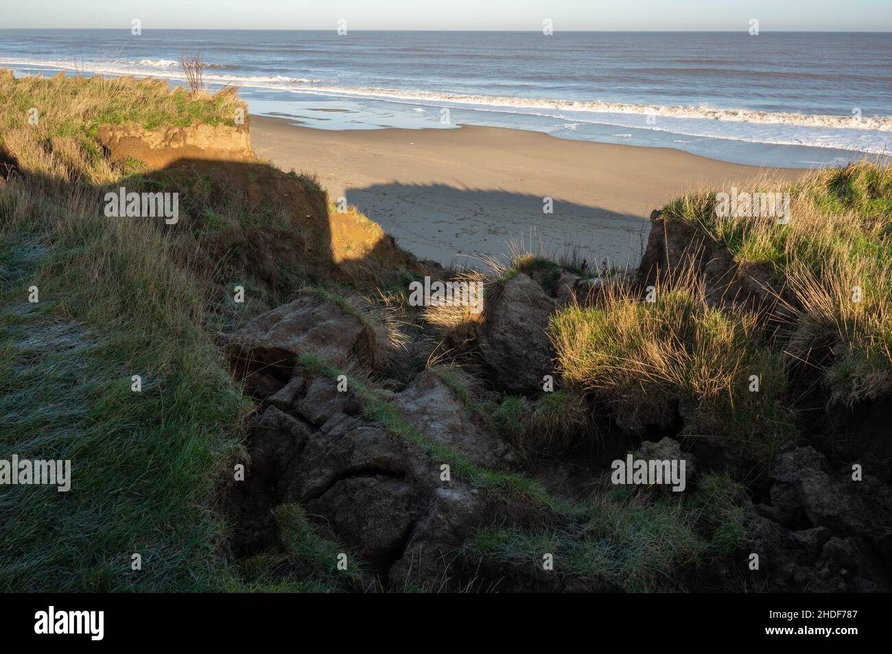 East Coast erosion at Happisburgh beach cliffs due to high spring tides ...