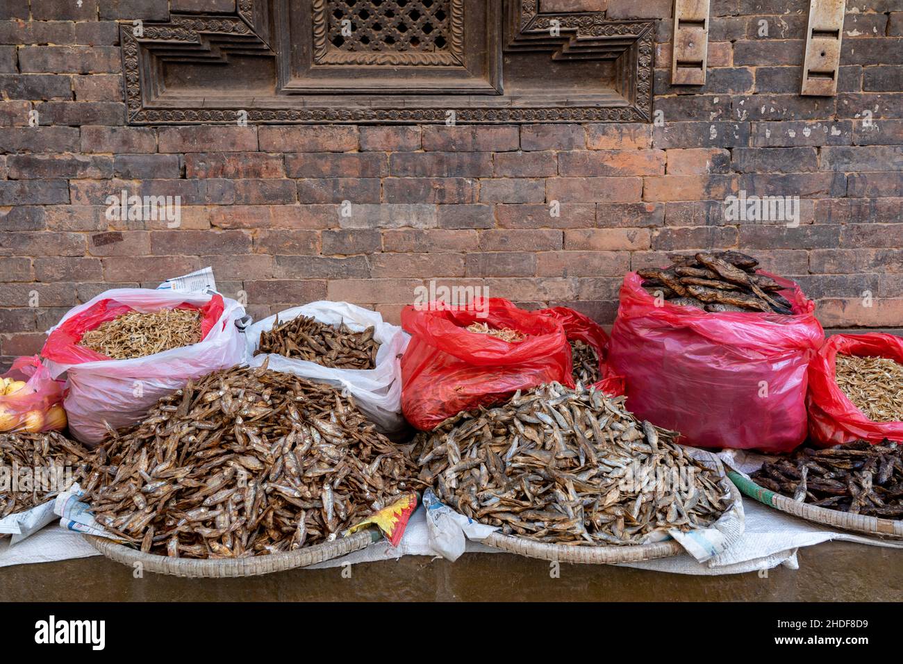 Bags of dried fish waiting for sale in an outdoor market Stock Photo ...