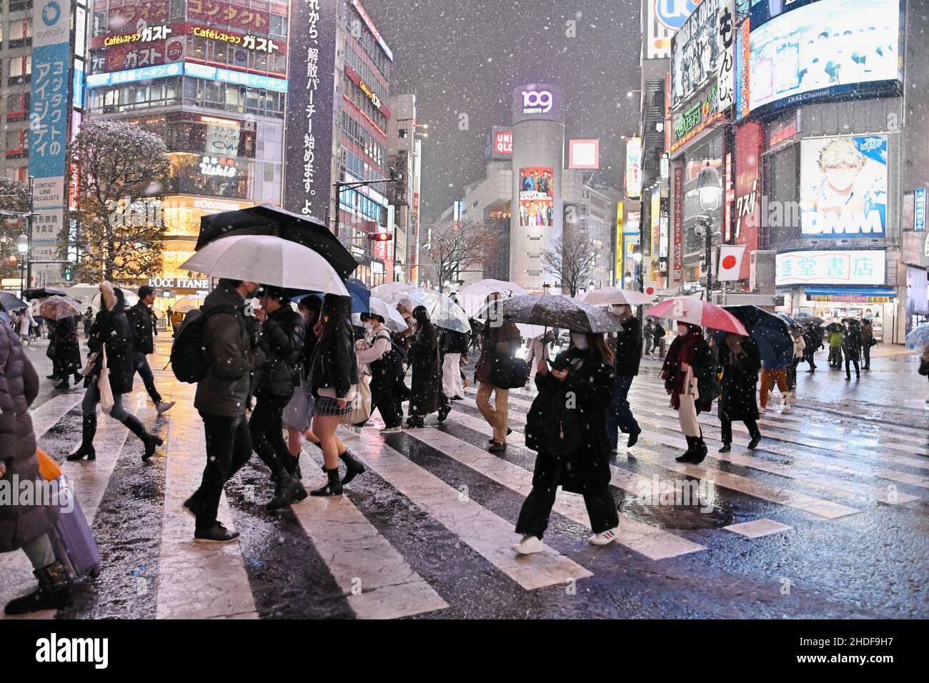 Tokyo, Japan. 06th Jan, 2022. Pedestrians walk across the Shibuya ...