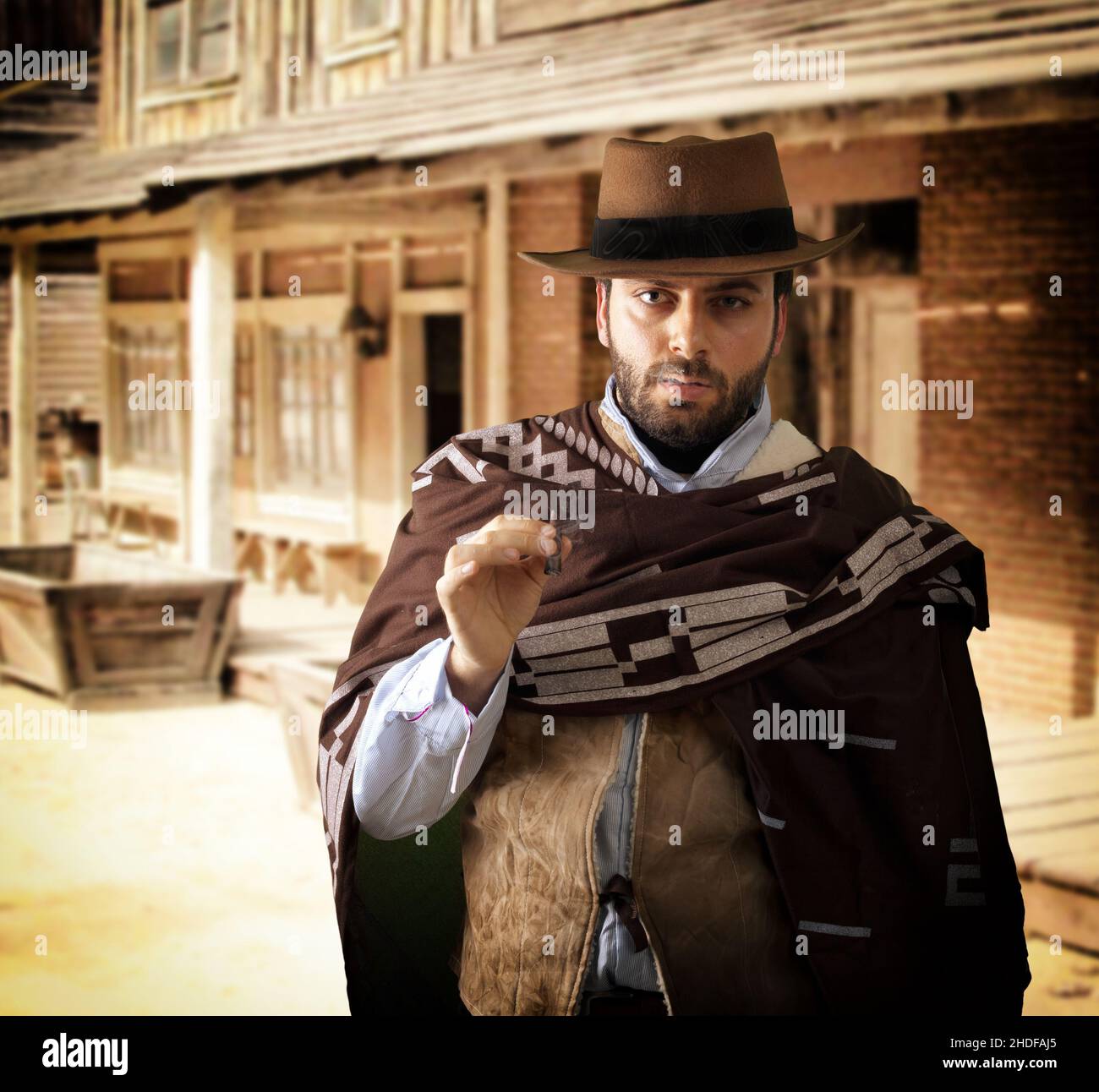 Cowboy smoking cigarette hi-res stock photography and images - Alamy