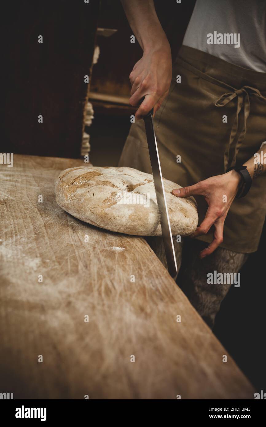 cutting, bakery, loaf, bakeries, cake shop, loafs Stock Photo - Alamy