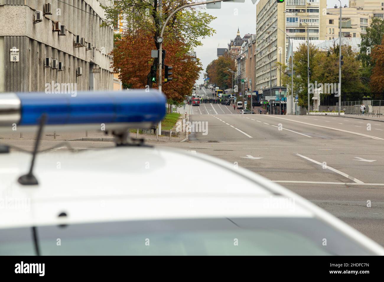 Blurred flashing lights of the police car on a city street Stock Photo ...