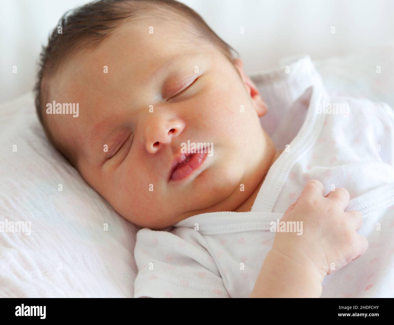 Newborn baby lying down hi-res stock photography and images - Alamy