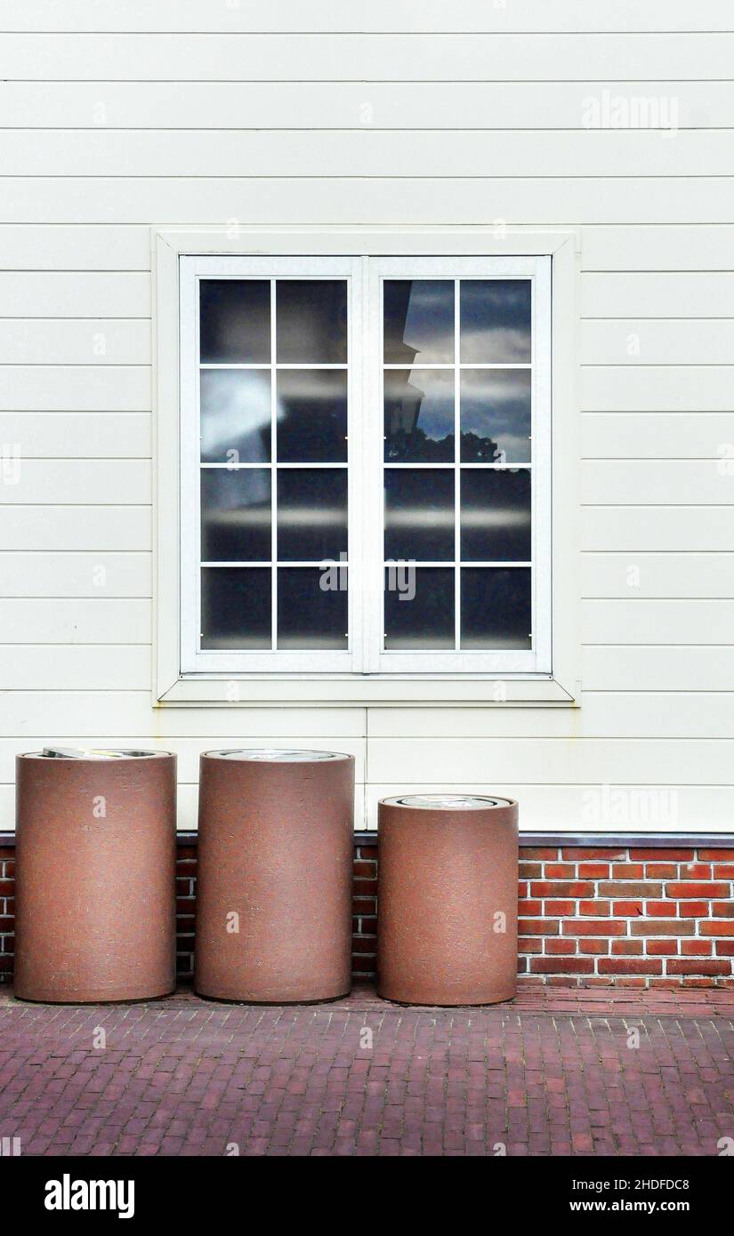 Vertical shot of a window with reflection and trash bins Stock Photo ...