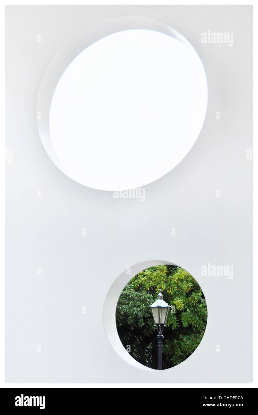 Vertical shot of round windows and a street light outdoors Stock Photo ...