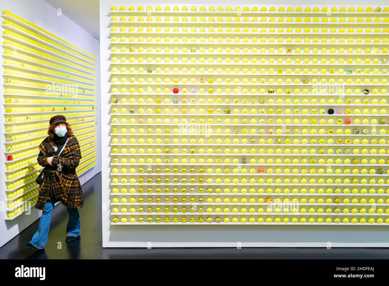 A visitor views some of the 12,000 tennis balls comprising 'Mayfair ...