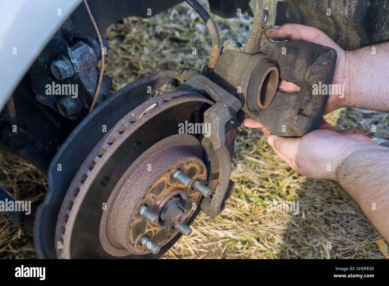 Car repair wheel hub of an old car brake pad, wheel axle Stock Photo ...
