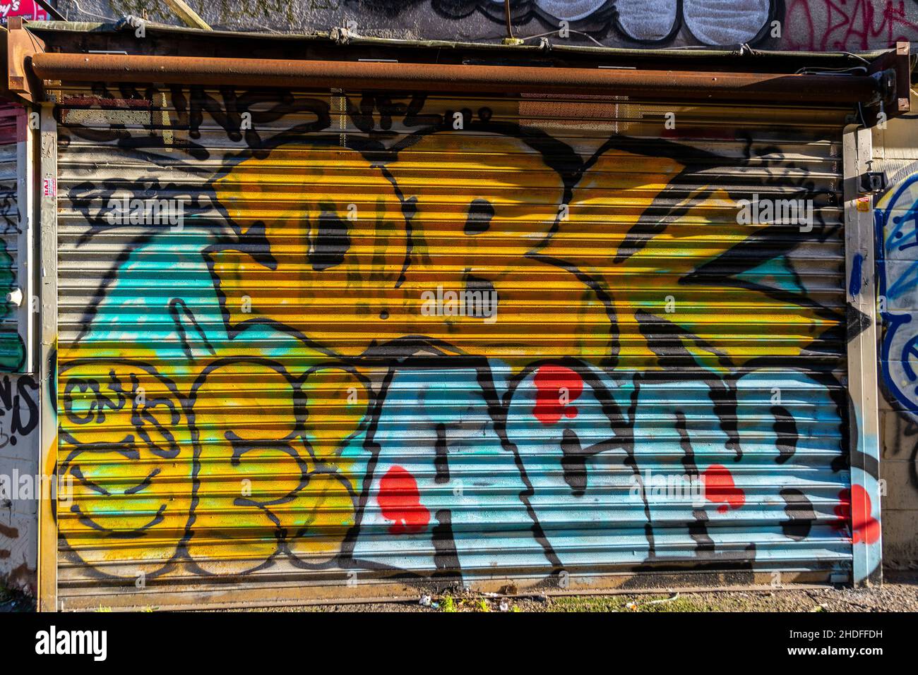 Graffiti covered shop shutter, Peckham, London Stock Photo - Alamy