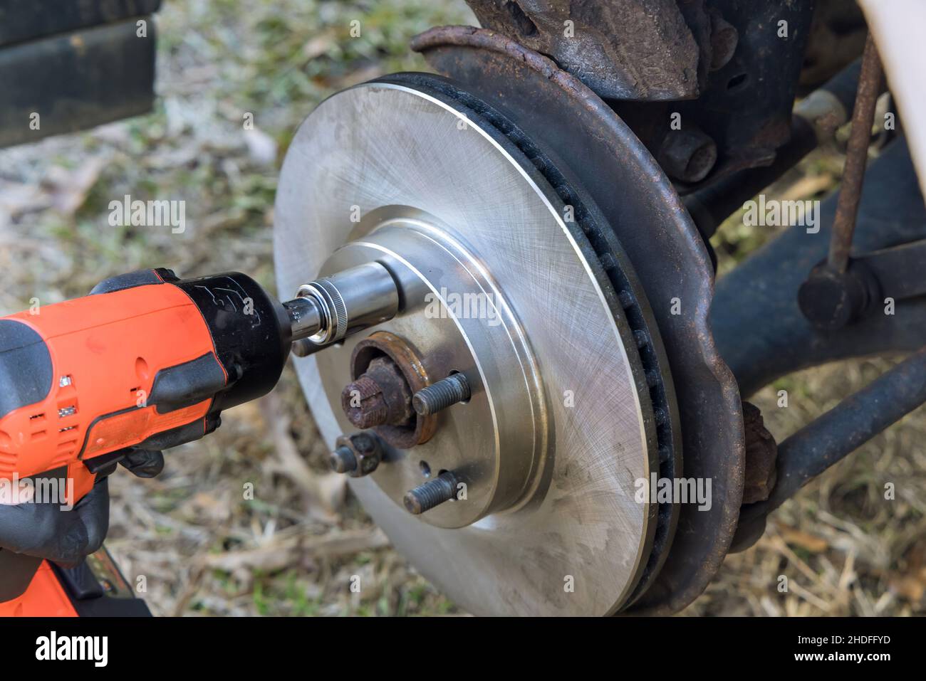 Car repair wheel hub of an old car brake pad, wheel axle Stock Photo ...