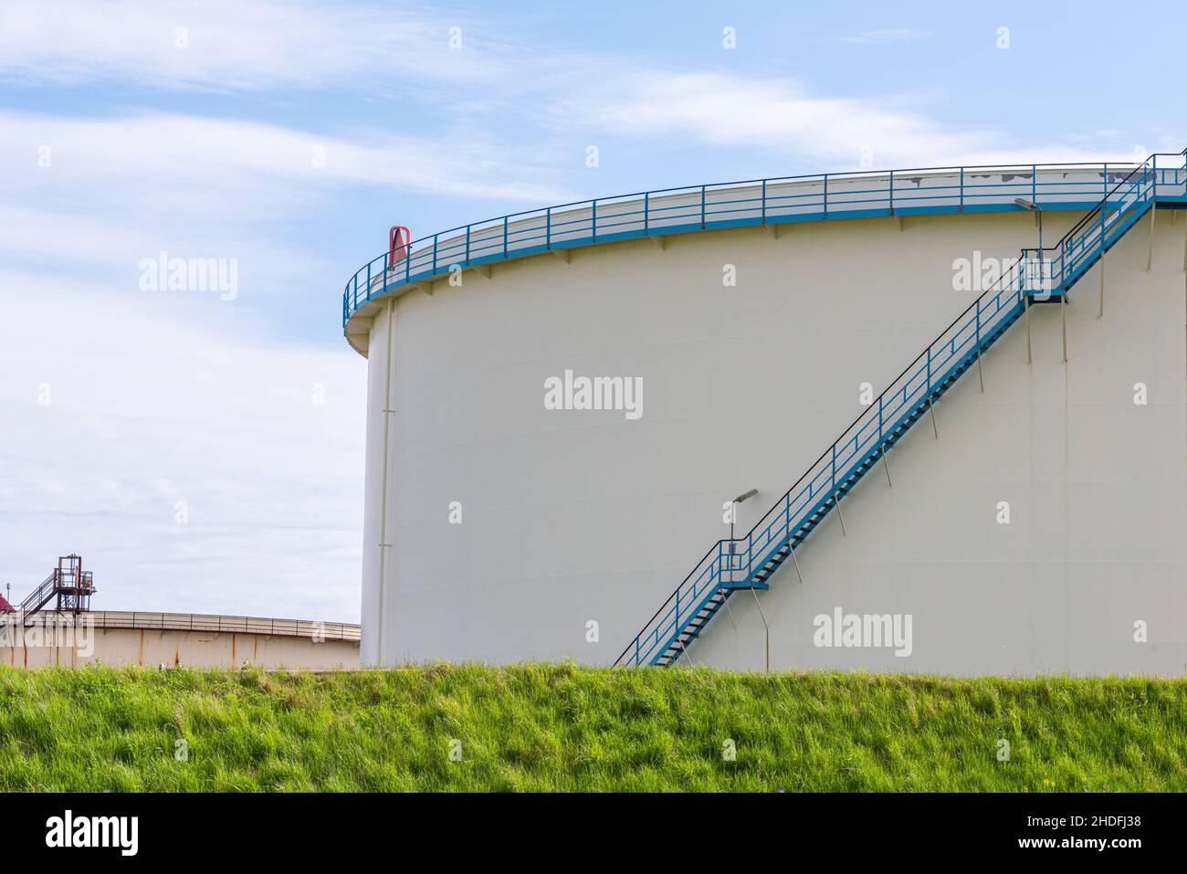 Blue ladder going up a large oil tank Stock Photo - Alamy