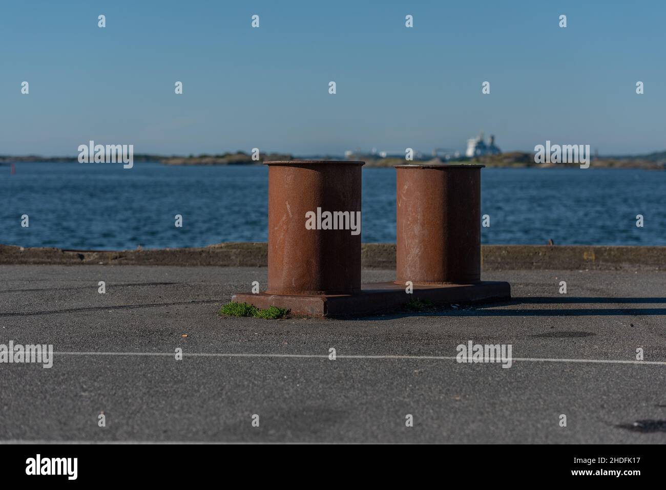 Large rusty iron bollards at a dock Stock Photo - Alamy