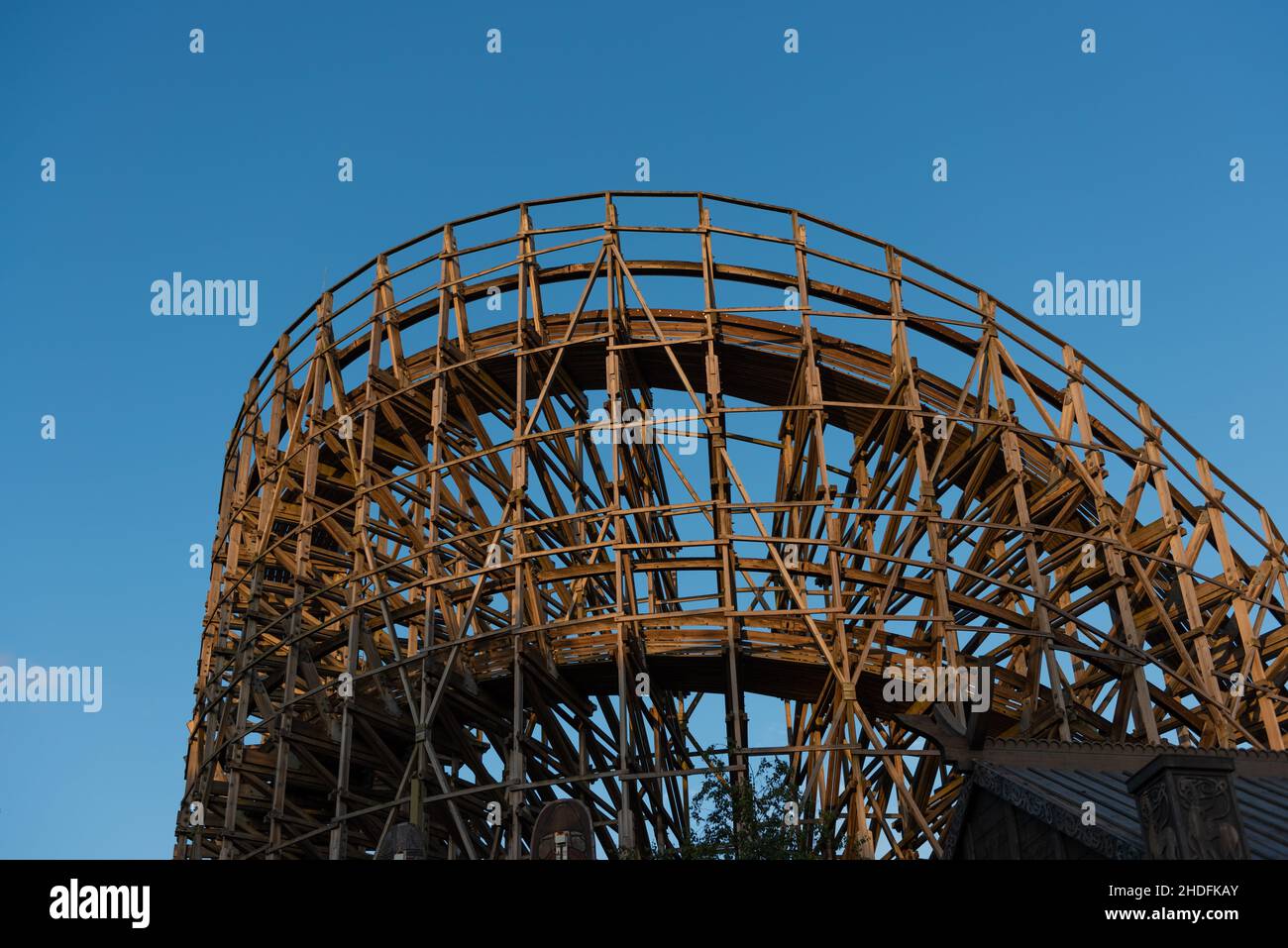 Curve of a large wooden roller coaster Stock Photo - Alamy