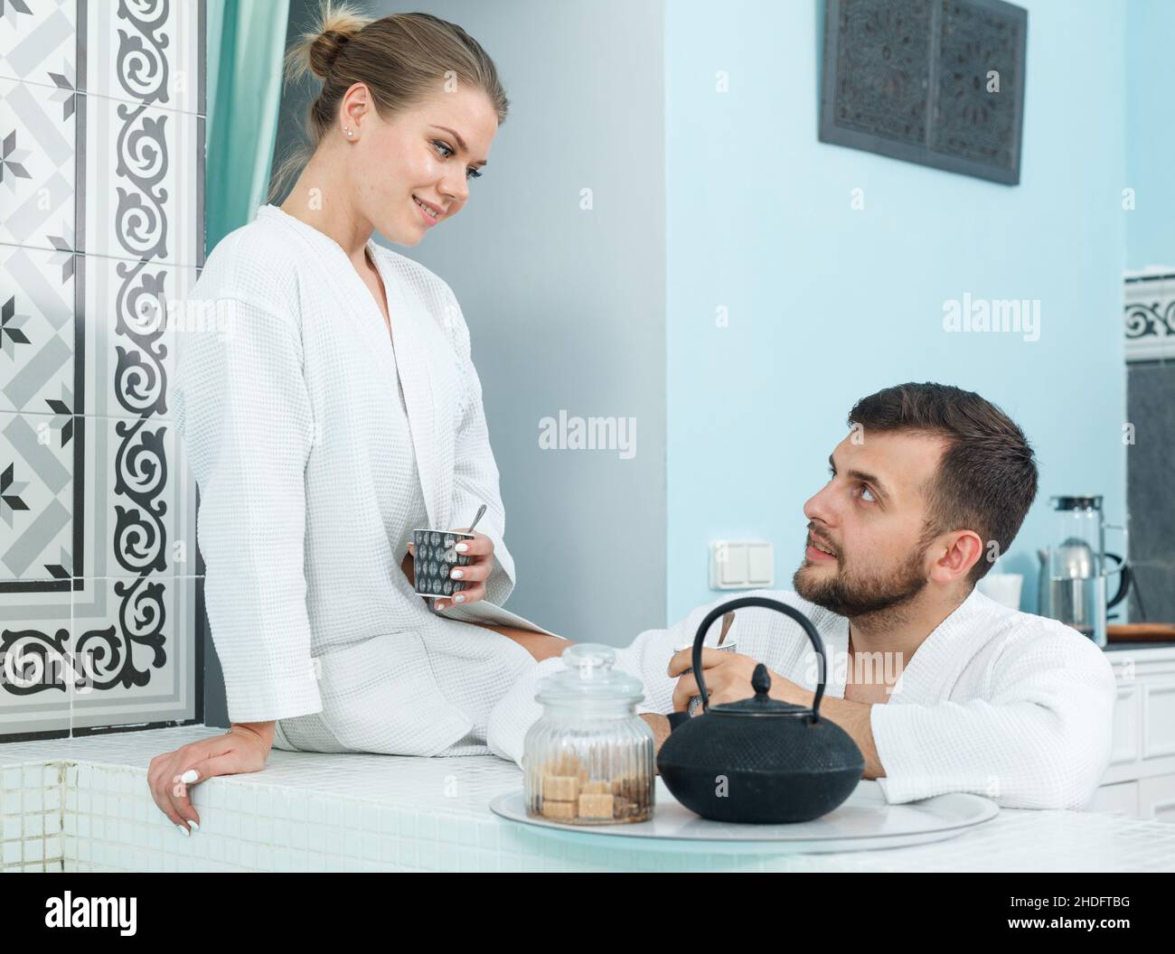 Couple drinking tea after spa Stock Photo - Alamy