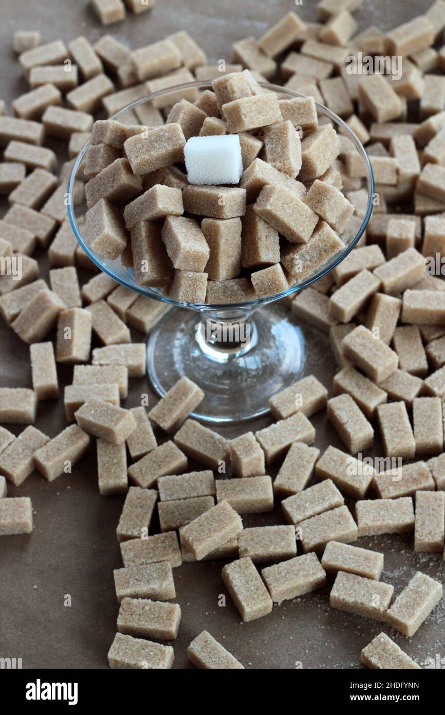 Brown sugar cubes in glass bowl,on the brown kraft paper with many ...
