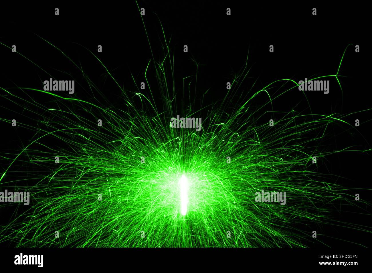 Sparkler, green sparks on a black background. Abstract photo of sparks ...