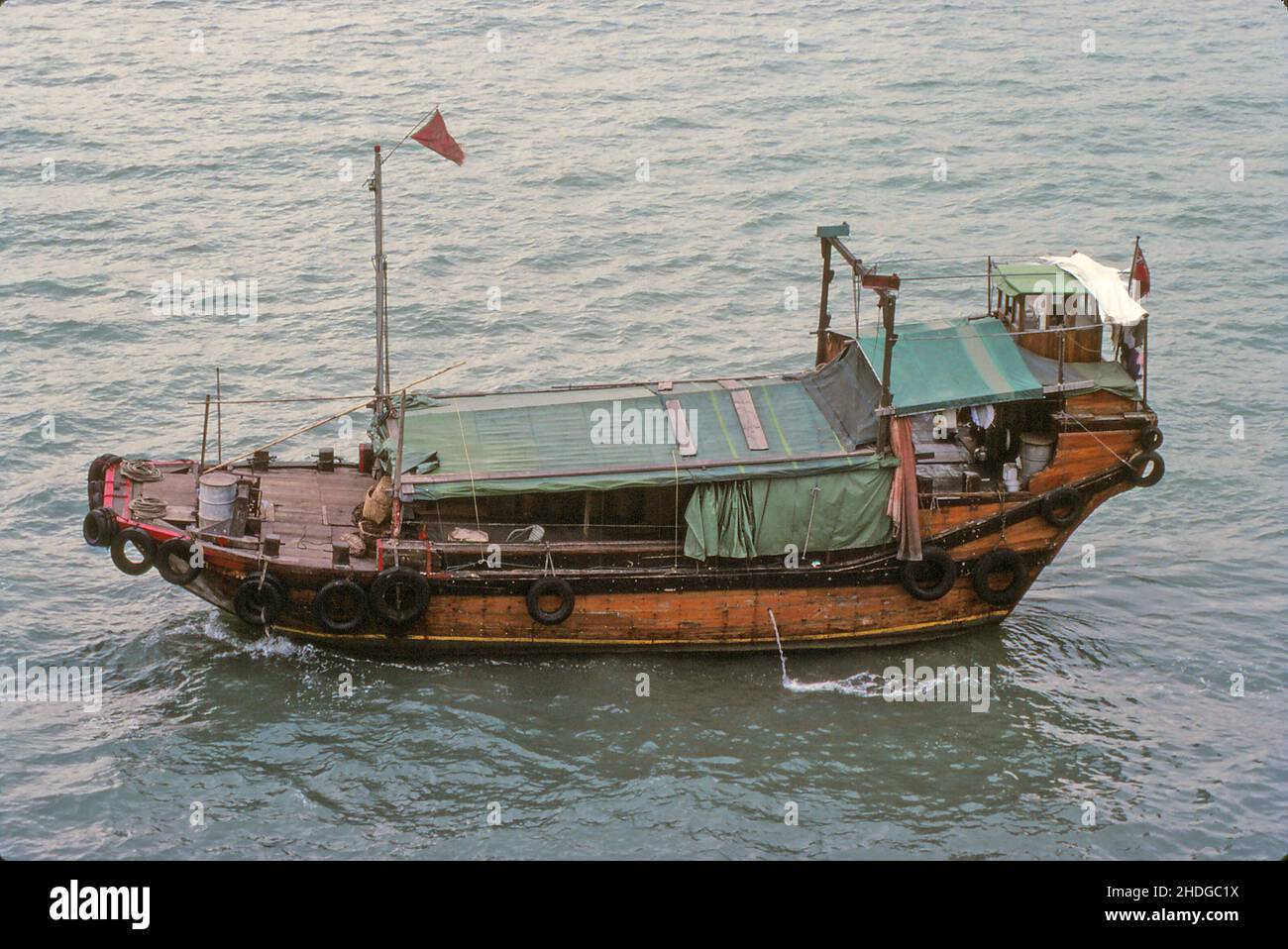 A Hong Kongese or Chinese barge flying the red ensign, Hong Kong ...