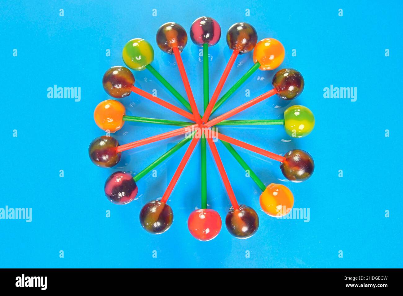 Various colorful lollipops on pastel background. Bright juicy colored ...