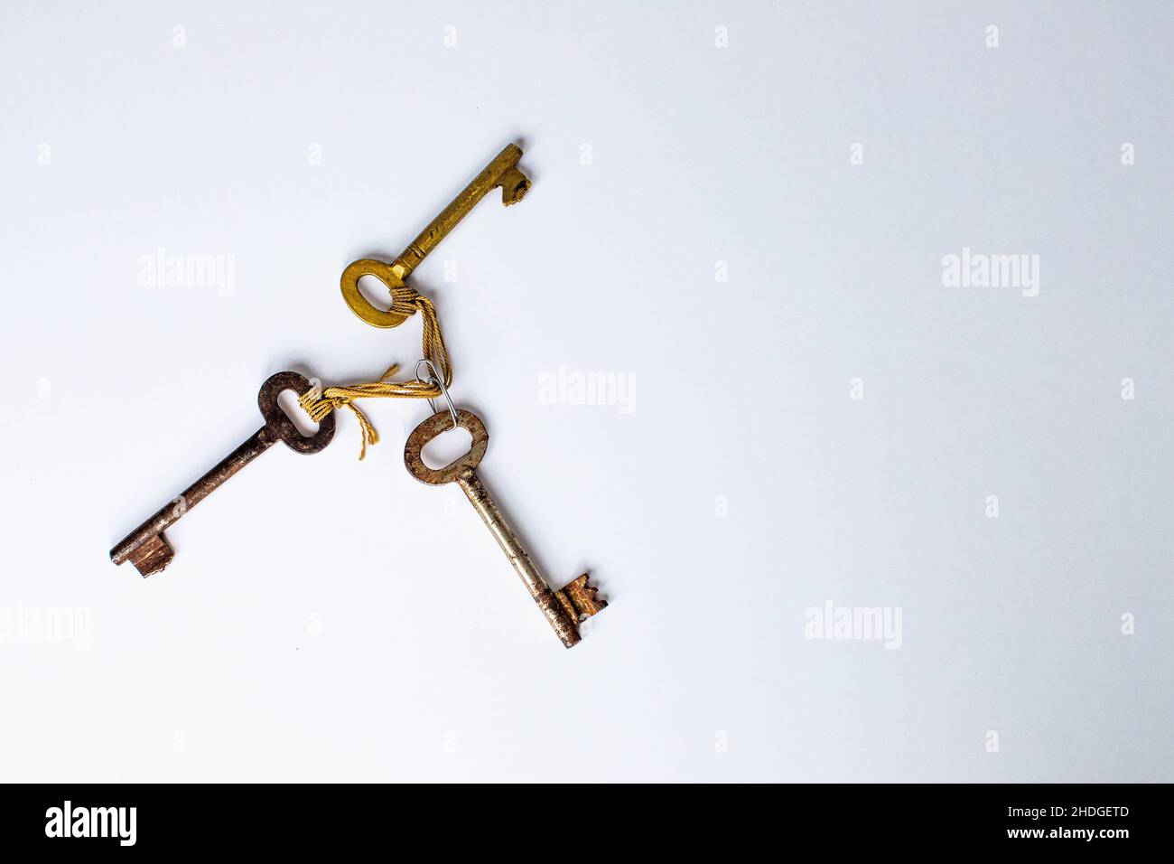 Vintage three keys isolated on white background Stock Photo - Alamy