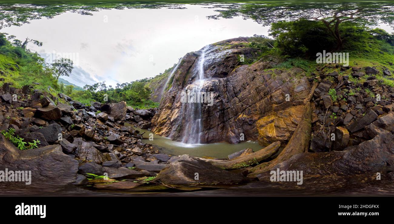 Tropical waterfall falls from the mountain cliff. Diyaluma Falls, Sri ...