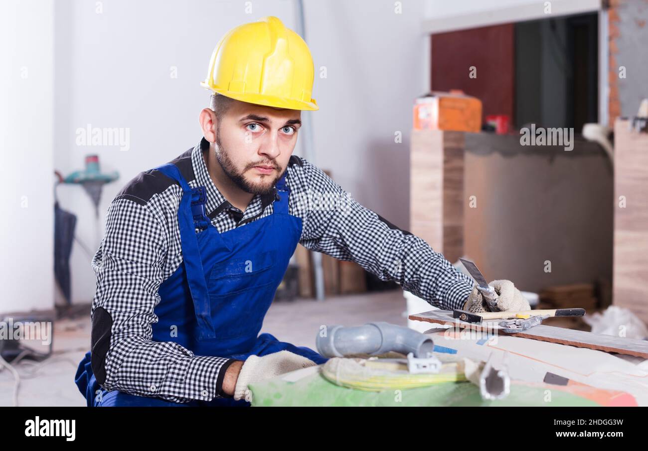 Builder is preparing for repair in the room at object Stock Photo - Alamy