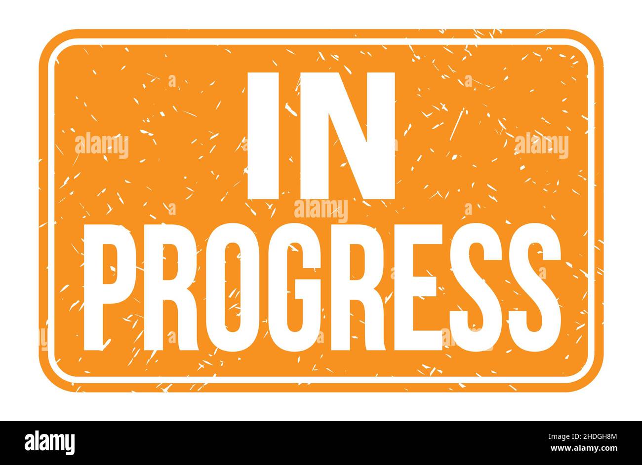 IN PROGRESS, words written on orange rectangle stamp sign Stock Photo ...