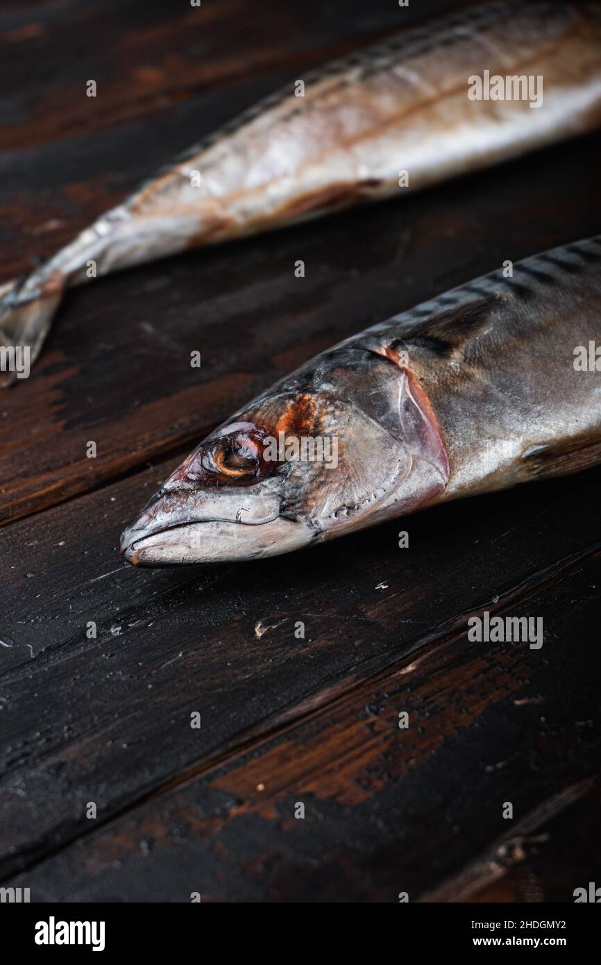 Two mackerel on wooden table with space for text Stock Photo - Alamy