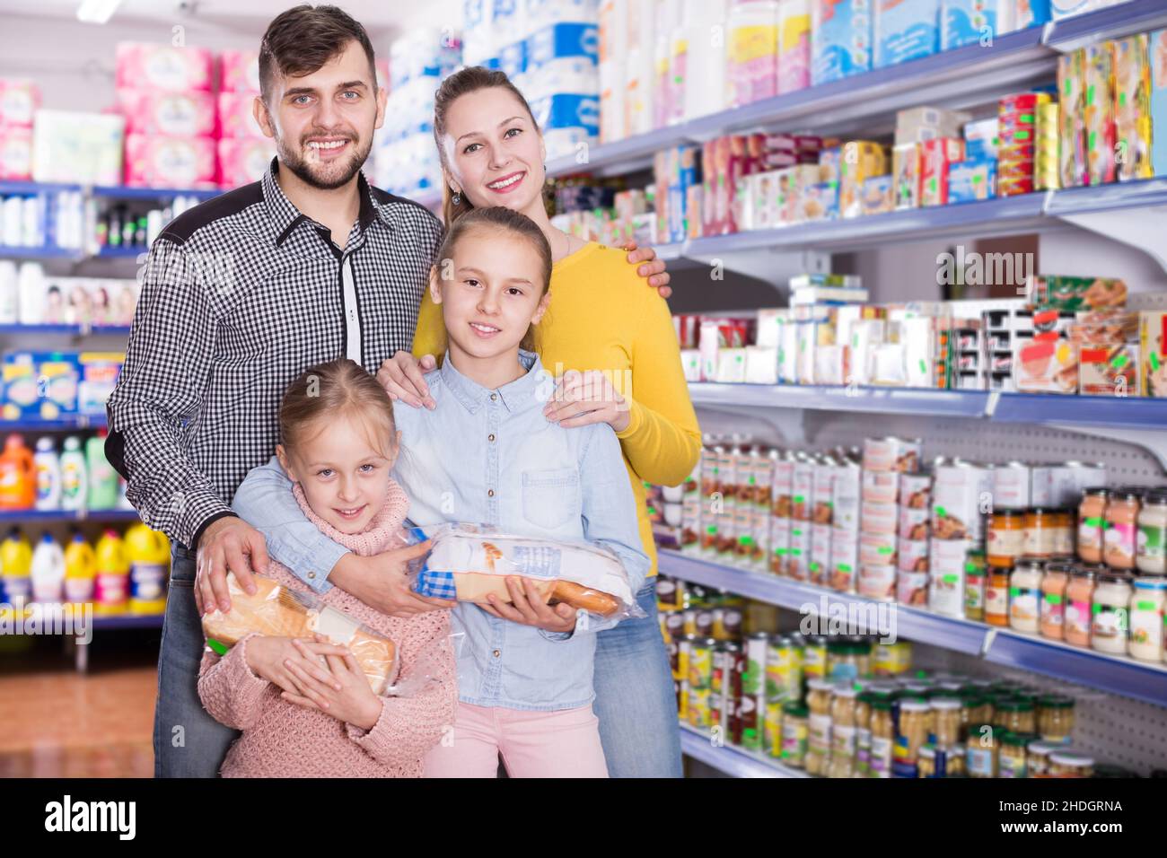 Portrait of family with daughters in food store Stock Photo - Alamy