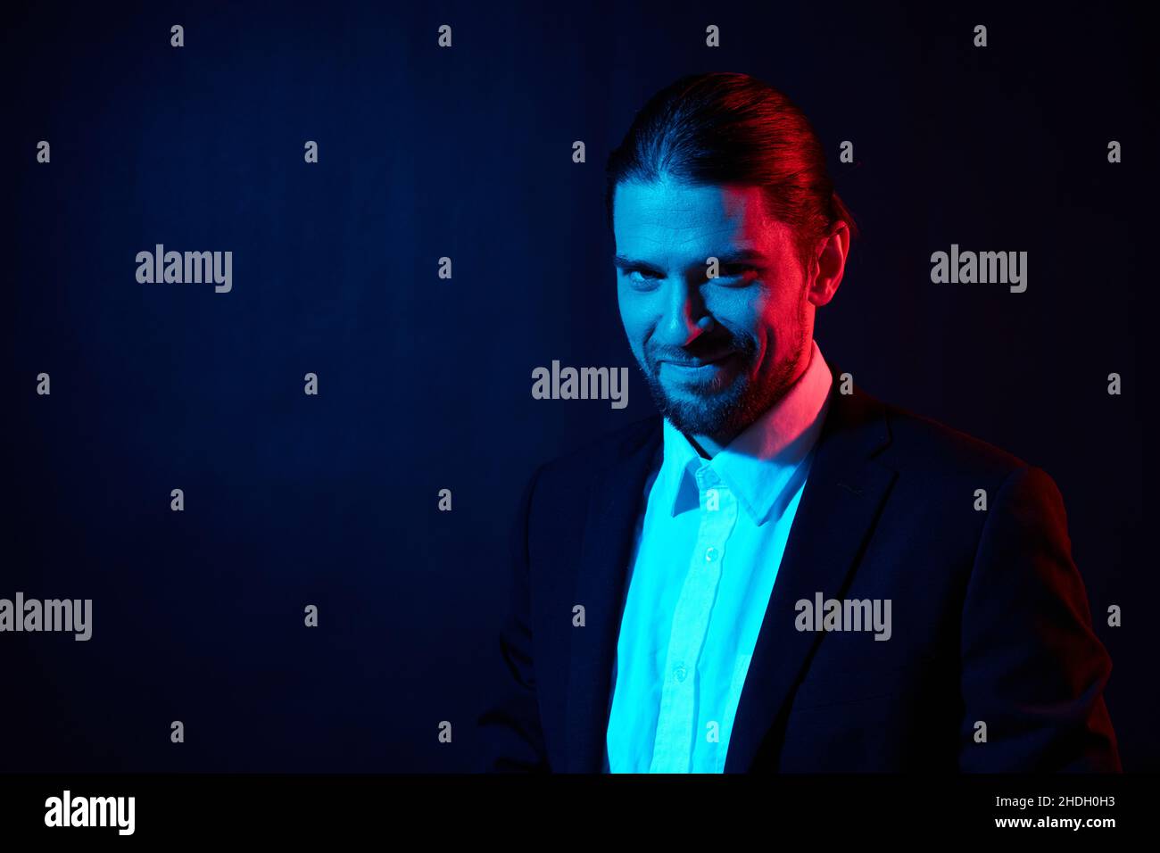 portrait of a man in costume posing fashion dark background Stock Photo ...