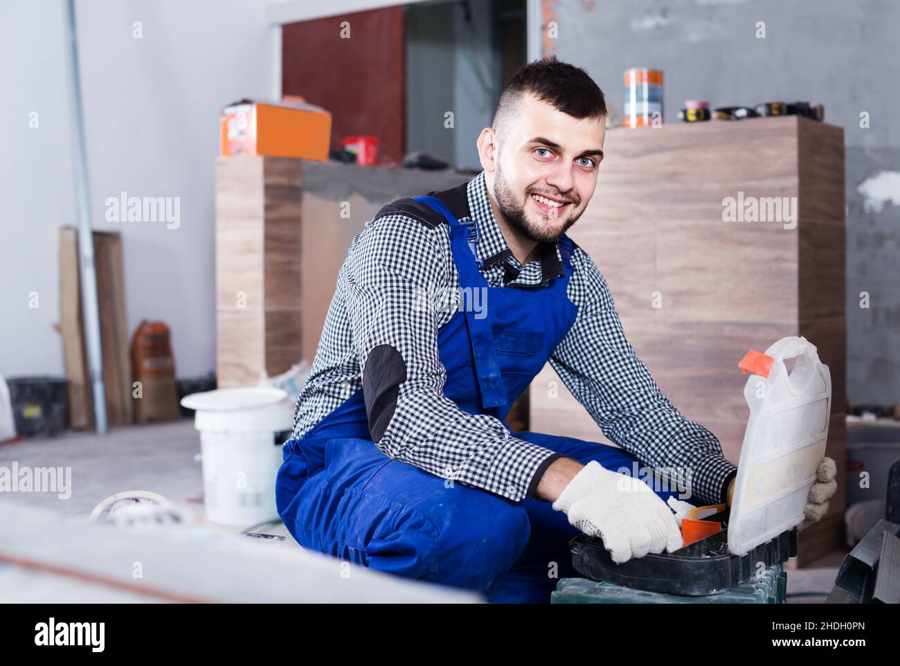 Worker is choosing tools in suitcase for work at the object Stock Photo ...