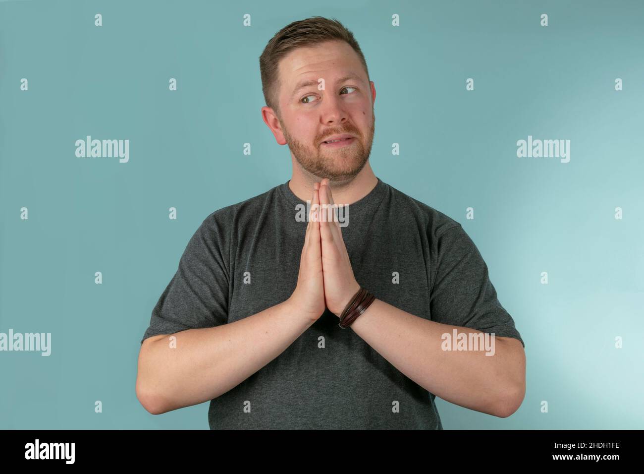Male praying hi-res stock photography and images - Alamy