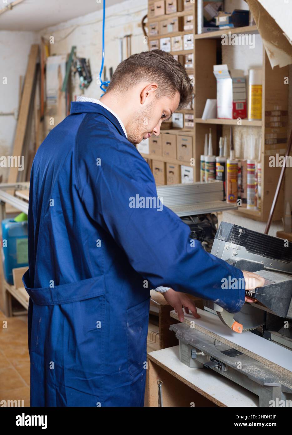 Working man practising his skills with disk saw machine Stock Photo - Alamy