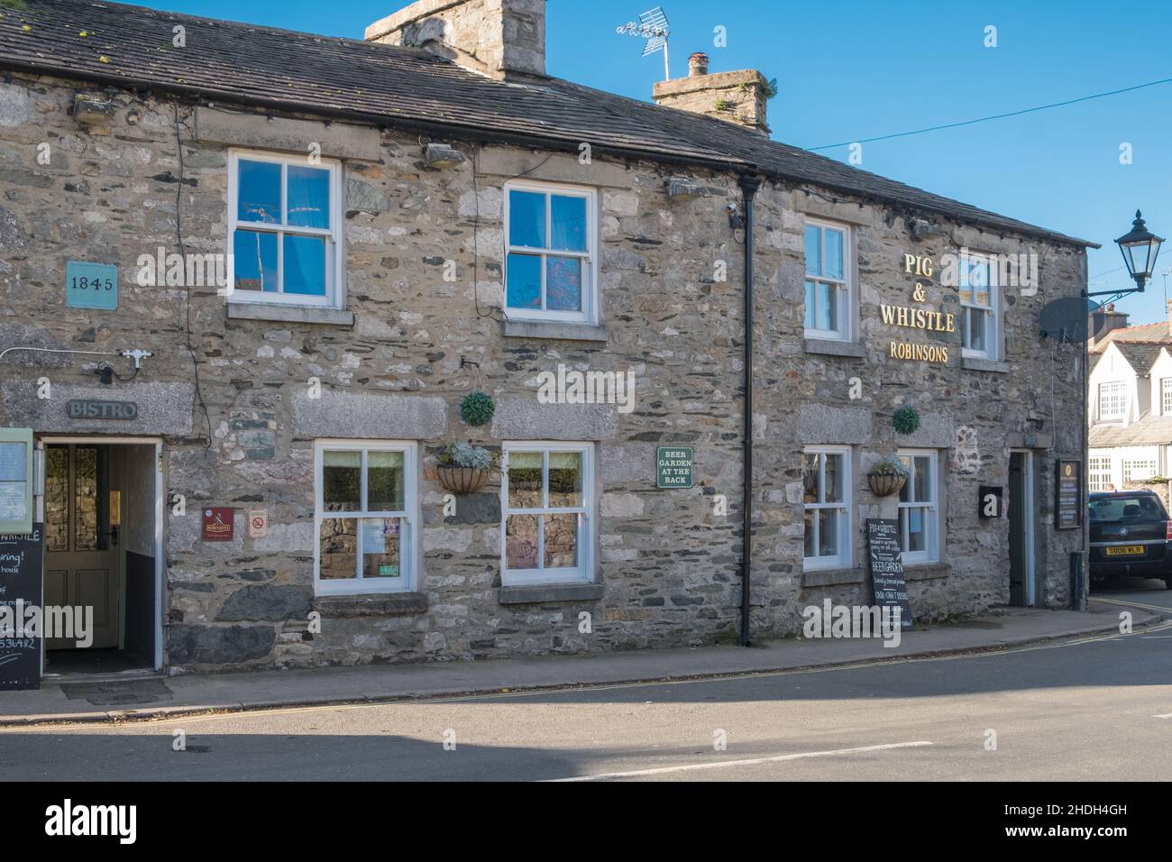 The Pig and Whistle pub in the village of Cartmel in the Lake District ...